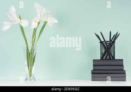 Fresh home workplace with style black stationery, books and decorative ...