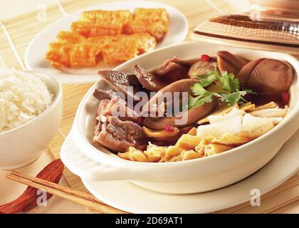 Chinese claypot rice with pork ribs, straw mushrooms and sunny side up ...