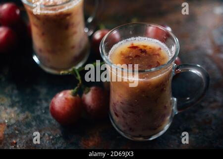 Grape lassi - made from fresh grapes on black table Stock Photo - Alamy