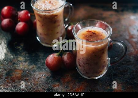 Grape lassi - made from fresh grapes on black table Stock Photo - Alamy