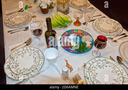 Passover table setting with a traditional Passover seder plate with ...