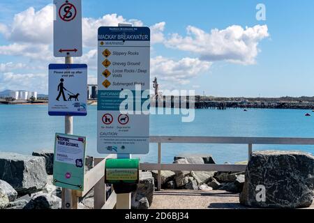 Warning signs on the breakwater at the harbour entrance at Porthleven ...
