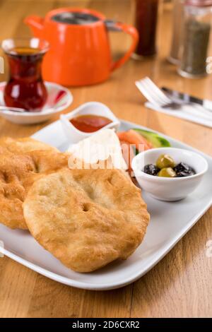 Traditional Turkish pastry : Pişi ; fried dough in oil with dill in ...
