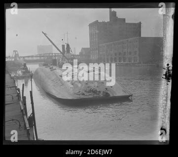 The SS Eastland overturned in the Chicago River near Clark Street ...