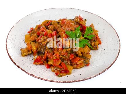 Vegetable saute of seasonal vegetables, eggplant with tomatoes on a ...