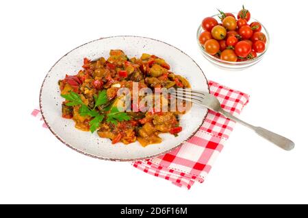 Vegetable saute of seasonal vegetables, eggplant with tomatoes on a ...