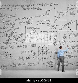 Man draw science formulas Stock Photo - Alamy
