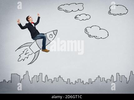 Man ride rocket Stock Photo - Alamy
