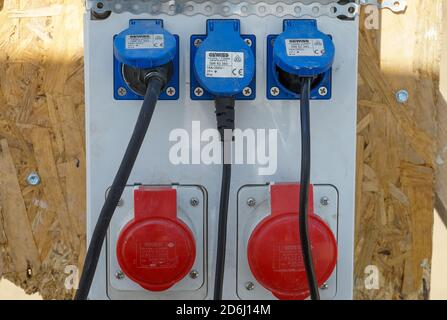 Industrial sockets and plug on distribution board. Construction site ...