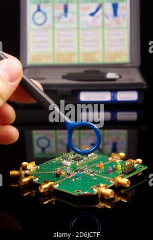 Electromagnetic compatibility (EMC) engineer holding magnetic near ...