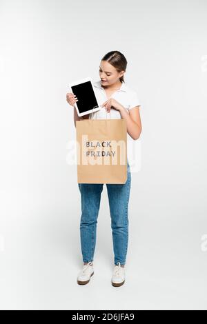 Black Friday sale. Blank white paper bag isolated on red background ...