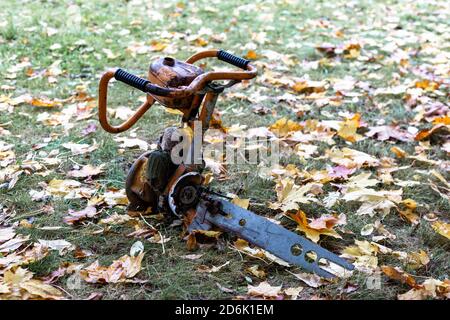 Broken chainsaw on the grass Stock Photo - Alamy