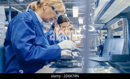 Factory worker with screwdriver Stock Photo - Alamy