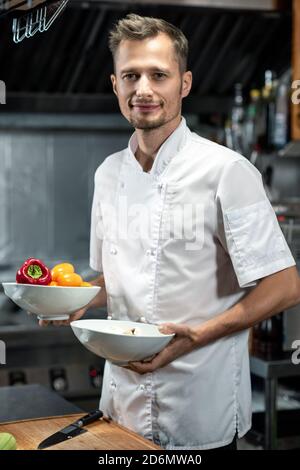 portrait of two male waiter preparing menu for customer Stock Photo - Alamy
