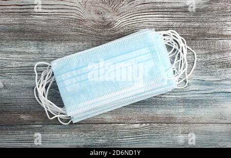 Medical protective masks on a gray background. Disposable 3-ply medical ...