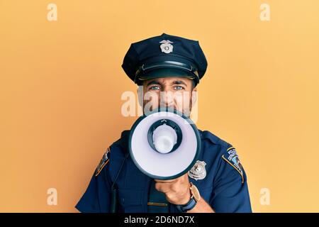 American police officer shouting through megaphone, yelling and ...