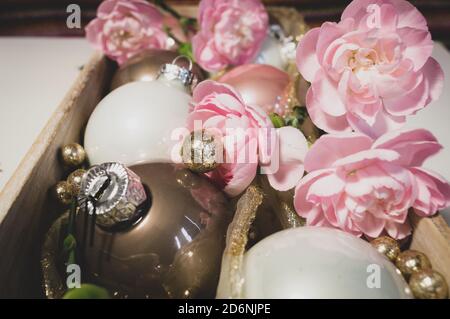 Close up of golden Christmas baubles in a spiral effect, hang above the ...