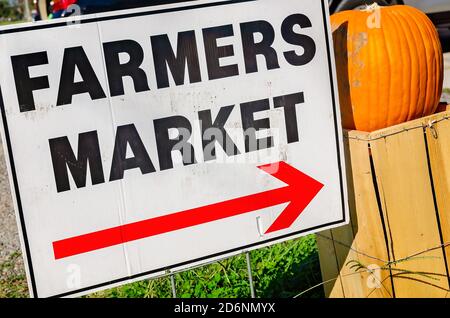 FARM MARKET FRESH PRODUCE SIGN AND OLD BARNS WITH WILD COSMOS FLOWERS ...