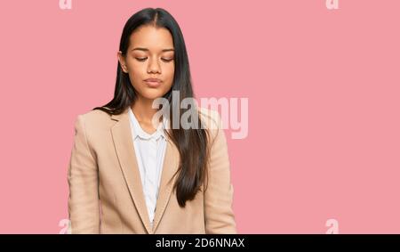 Brunette hispanic girl making fish face with lips, crazy and comical ...