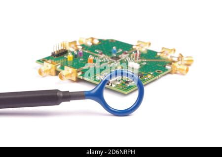 Electromagnetic compatibility (EMC) engineer holding magnetic near ...