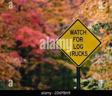 log trucks warning sign Stock Photo - Alamy
