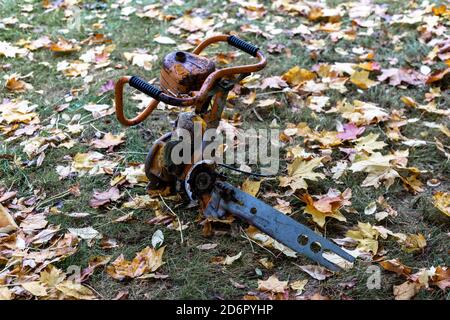 Broken chainsaw on the grass Stock Photo - Alamy