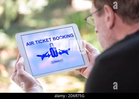 Tablet screen displaying an air ticket booking concept Stock Photo - Alamy
