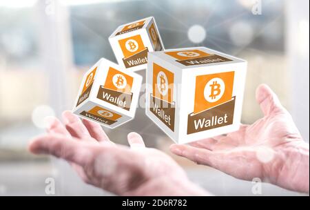 Bitcoin wallet concept above the hands of a man in background Stock ...