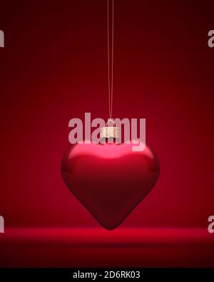 A glossy red bauble with the golden shape of a gift.(series Stock Photo ...