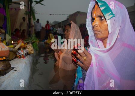 Indian women performing chhath pooja.Chhath is an ancient Hindu Vedic ...