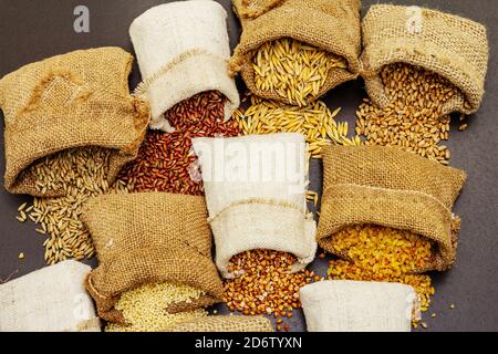 Assorted variety of cereals in handmade sacks. Mix of indispensable ...
