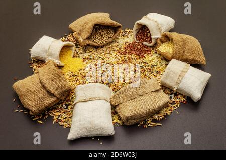 Assorted variety of cereals in handmade sacks. Mix of indispensable ...