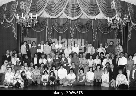Holidaymakers and a Redcoat at Butlin's holiday camp Stock Photo - Alamy