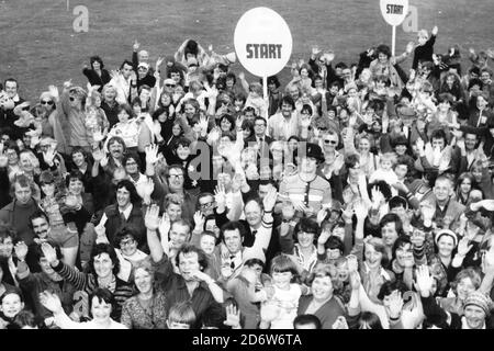 A crowd of holidaymakers at Butlin's holiday camp, Filey, pose with an ...