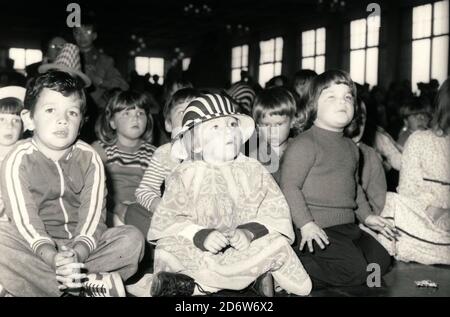 Holidaymakers and a Redcoat at Butlin's holiday camp Stock Photo - Alamy
