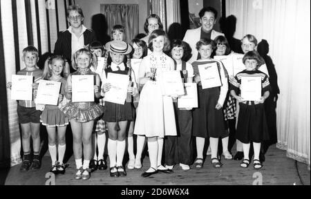 Holidaymakers and a Redcoat at Butlin's holiday camp Stock Photo - Alamy