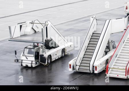 Passenger ladders for boarding passengers in an airplane. Airplane ...