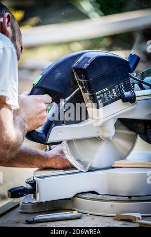 Man using industrial saw Stock Photo - Alamy