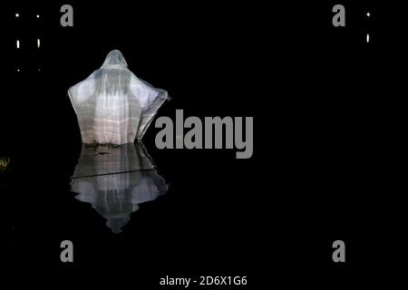 A person performs during the show of the Legend of the weeping woman ...
