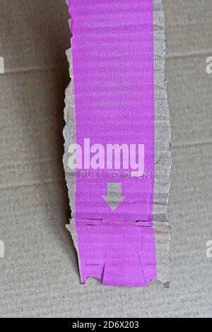 Pull to open easy strip at box Stock Photo - Alamy