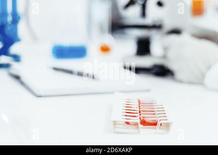 blurry image of a desktop in a medical laboratory Stock Photo - Alamy