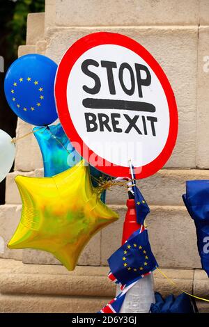Anti-Brexit campaign poster being used by protesters outside the Houses ...