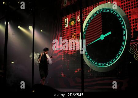A contestant demonstrating his skills on stage, during a vape cloud ...