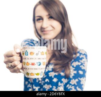 Young woman in pajamas with hot water bottle to relieve menstrual pain ...