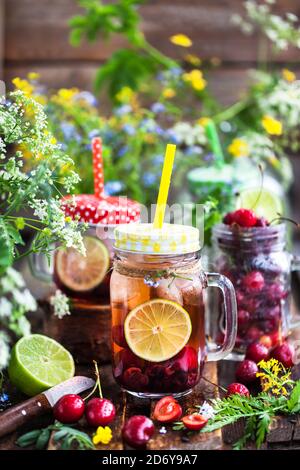 Fresh lemonade jar with summer fruits and berries. With space for your ...