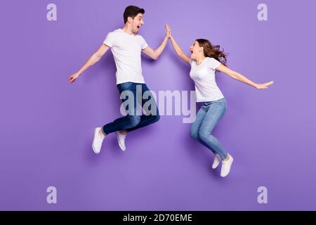 male jumper high jump side view, successful attempt in track and field ...