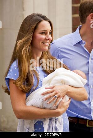 Prince William smiles as he holds newborn baby Sina Nuru in the new ...