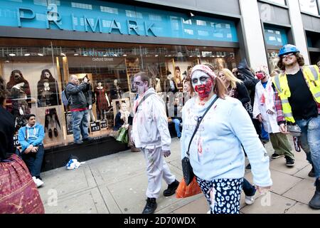 People dressed as zombies parade along Oxford Street, London, as part ...