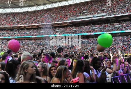 Giant inflatable balloons are passed around the crowd during Capital FM ...