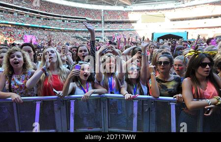 Giant inflatable balloons are passed around the crowd during Capital FM ...